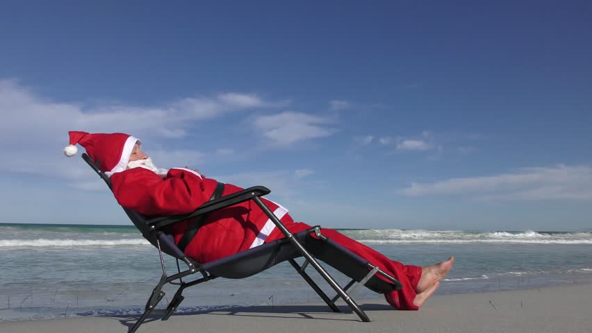 Santa Claus Lying Relaxed Resting Bare Feet In Chair Enjoying Sunny Holiday Vacation At Ocean