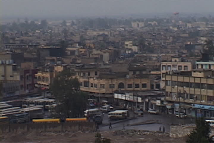 View Of The Ancient City Of Kirkuk Under A Big, Cloud-filled Sky In ...