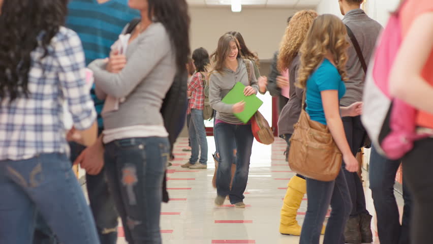 Students Run After Each Other Through The Hallway Full Of Other Kids ...