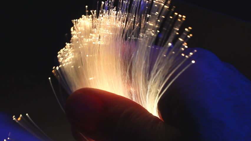 Handful Of Brightly Lit Fiber Optic Cables. Light And Data Transmission ...